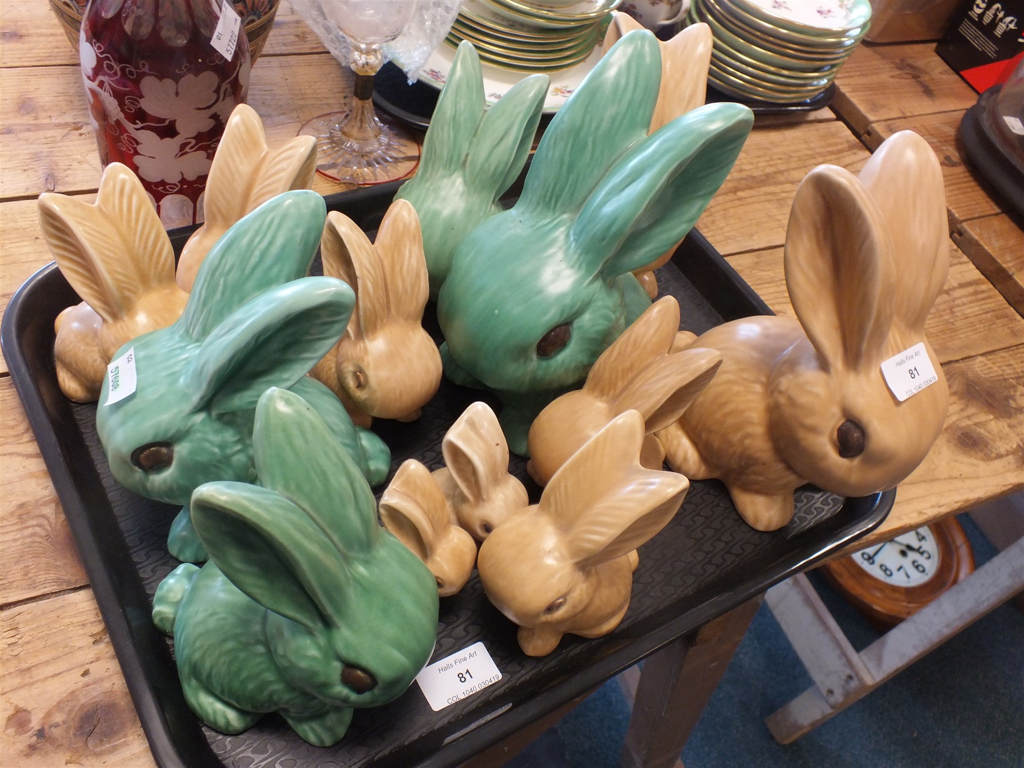 Lot 81 - Thirteen Sylvac models of rabbits in green