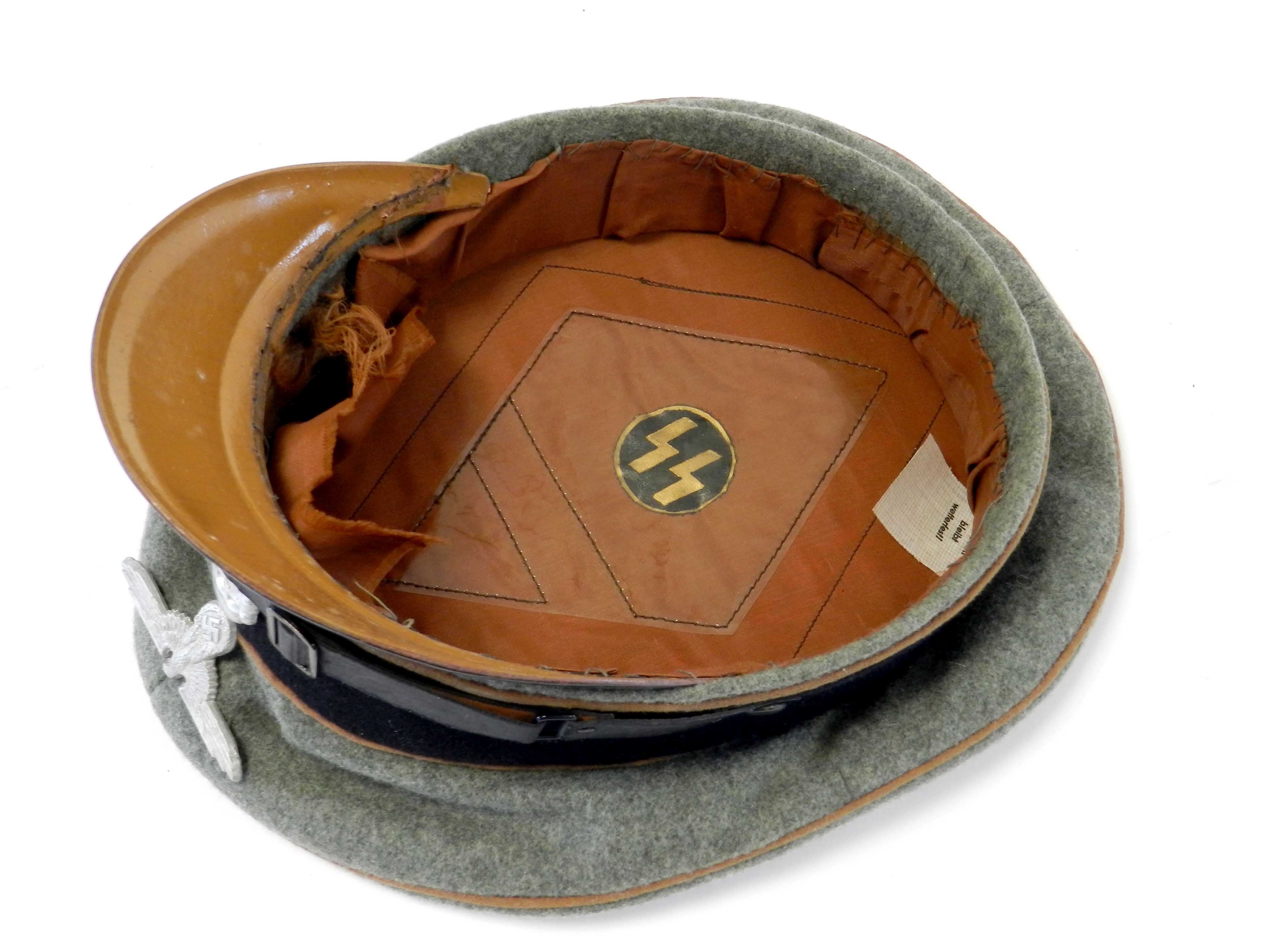 Lot 553 - A reproduction Waffen SS NCO/EM visor cap