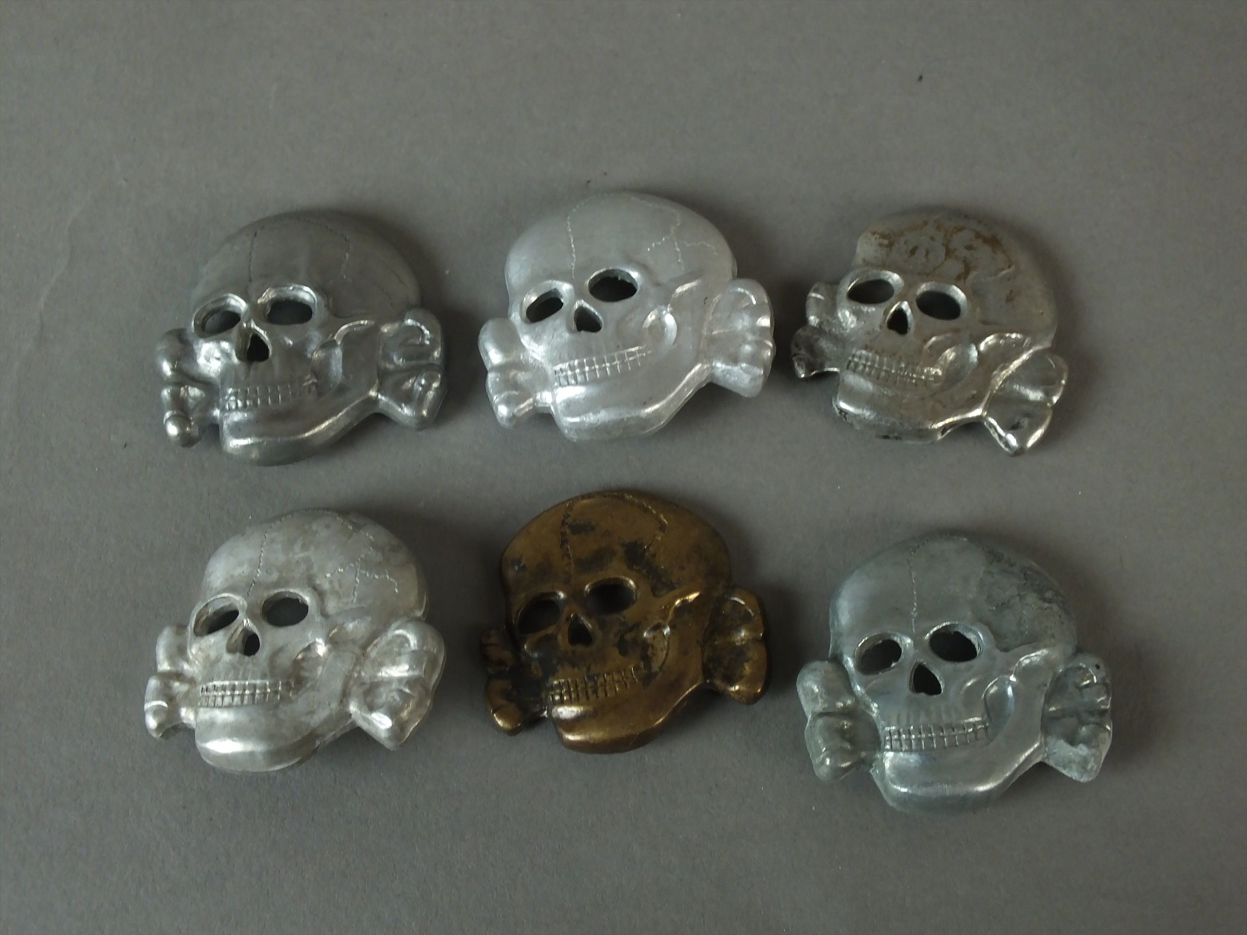 Lot 336 - Reproduction German SS visor cap skulls and