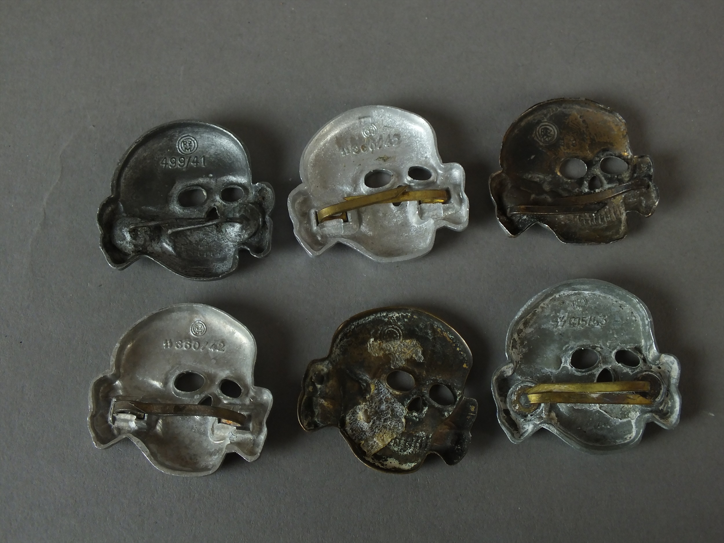 Lot 336 - Reproduction German SS visor cap skulls and