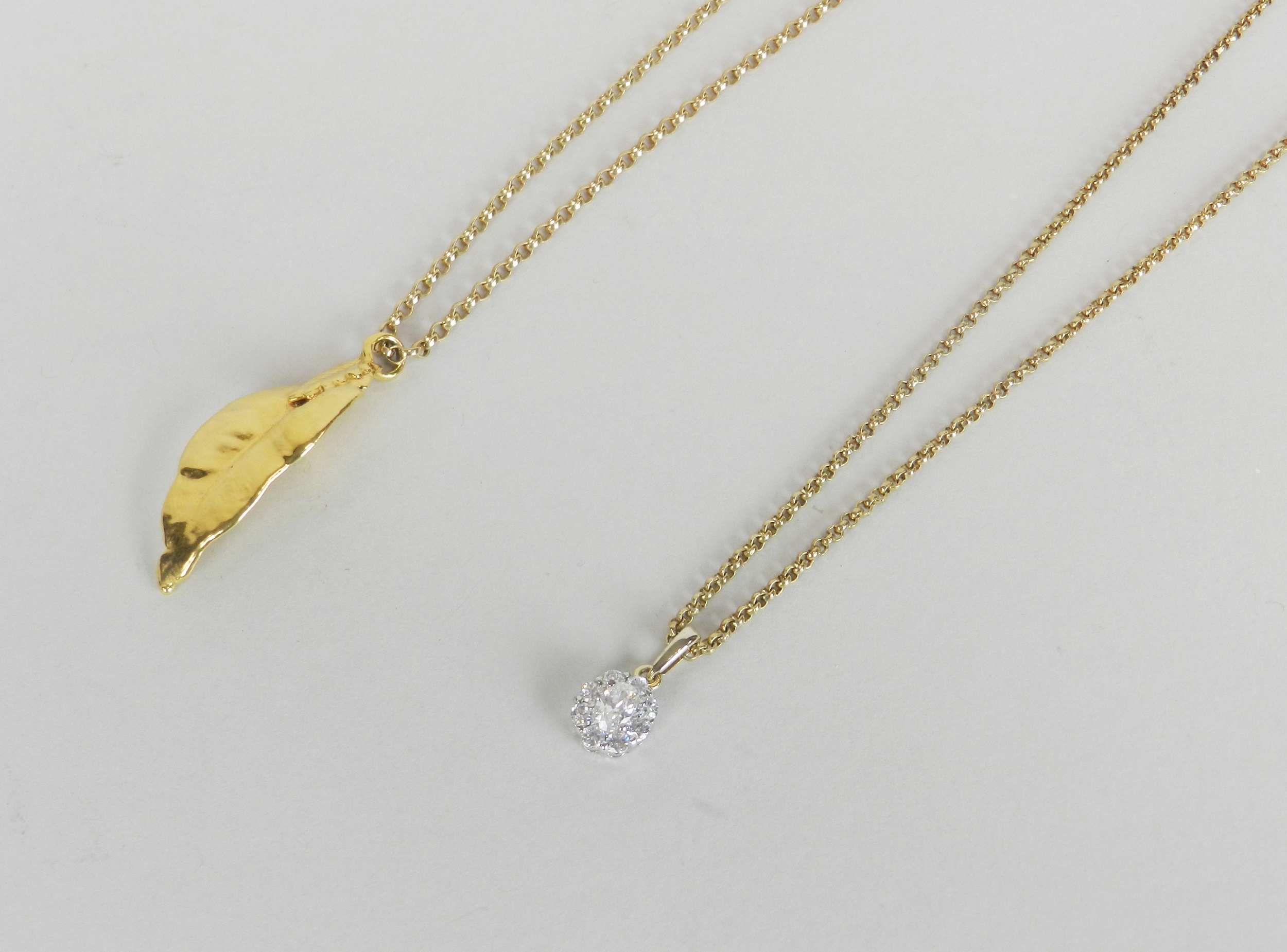 Lot 46 - Two pendants on chains