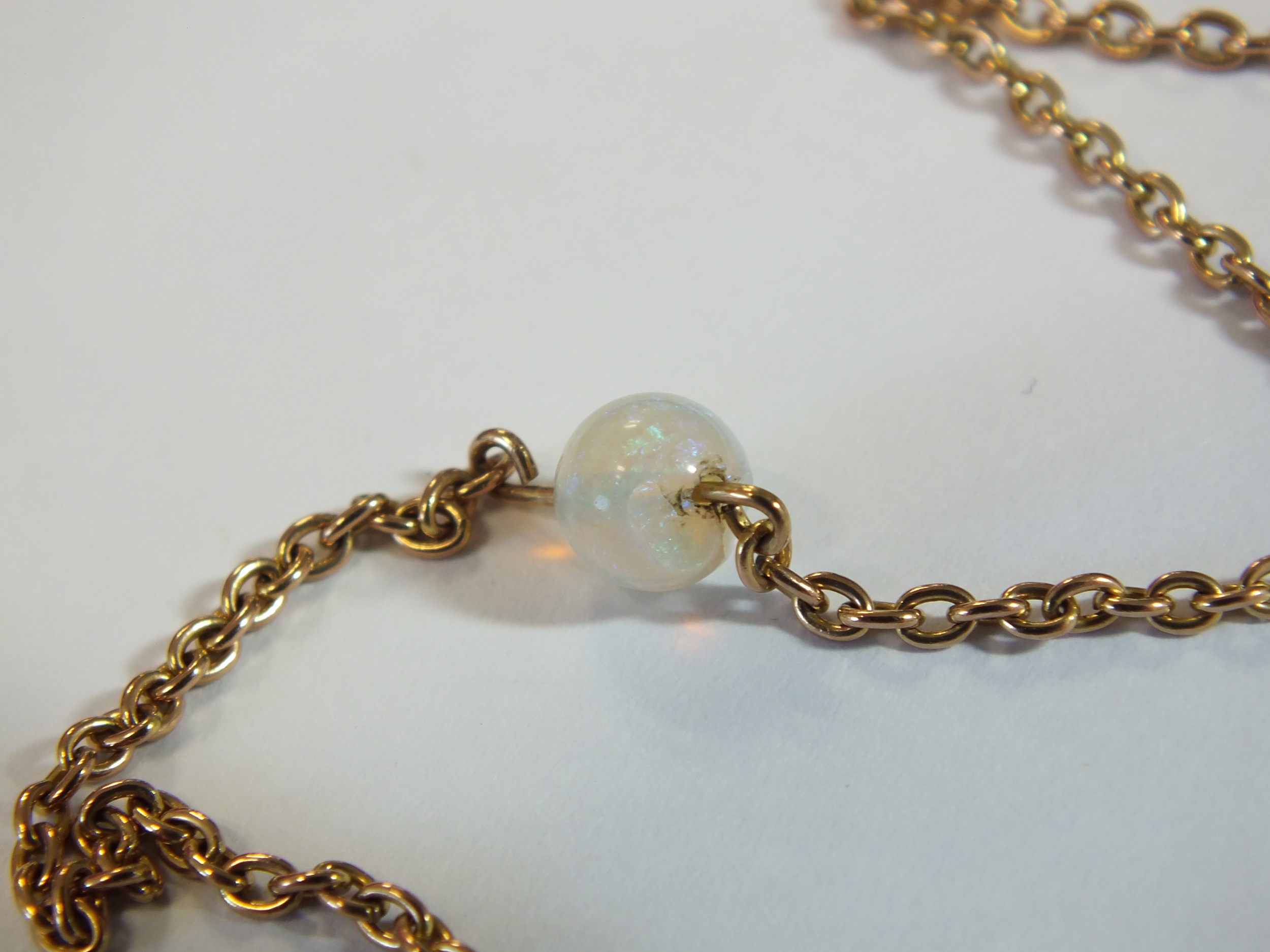 Lot 103 - An opal bead guard chain