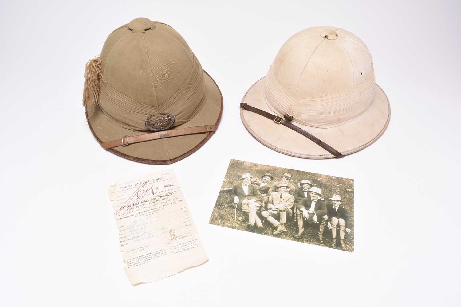 Lot 99 - Two pith helmets with provenance, including