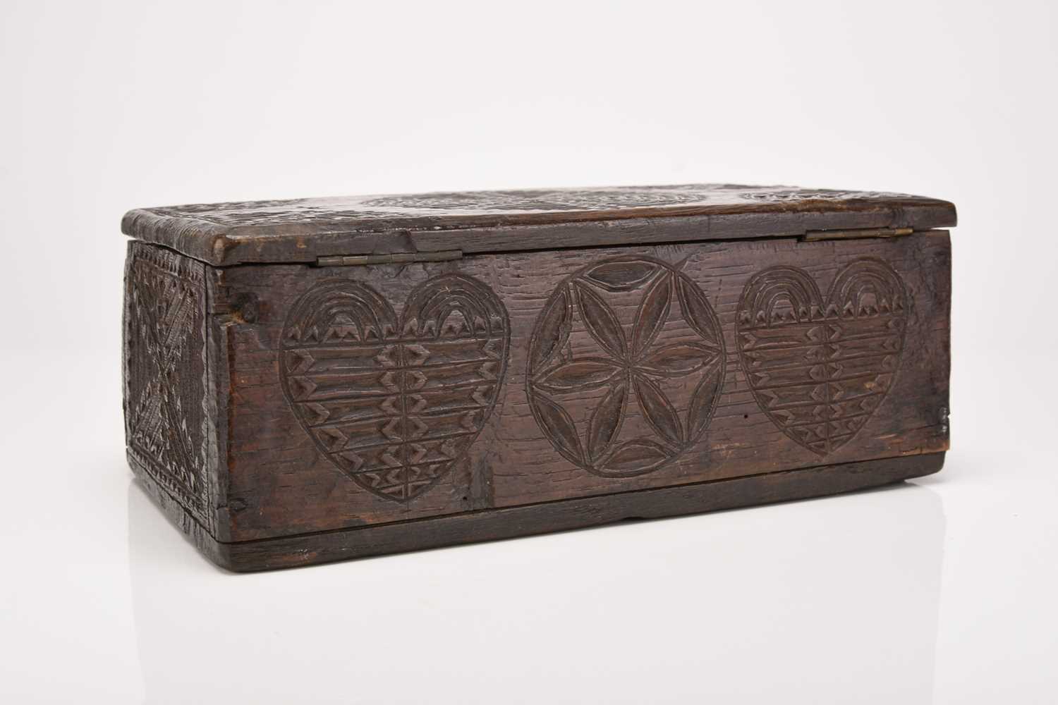 Lot 57 - A carved oak coffret or missel box, circa