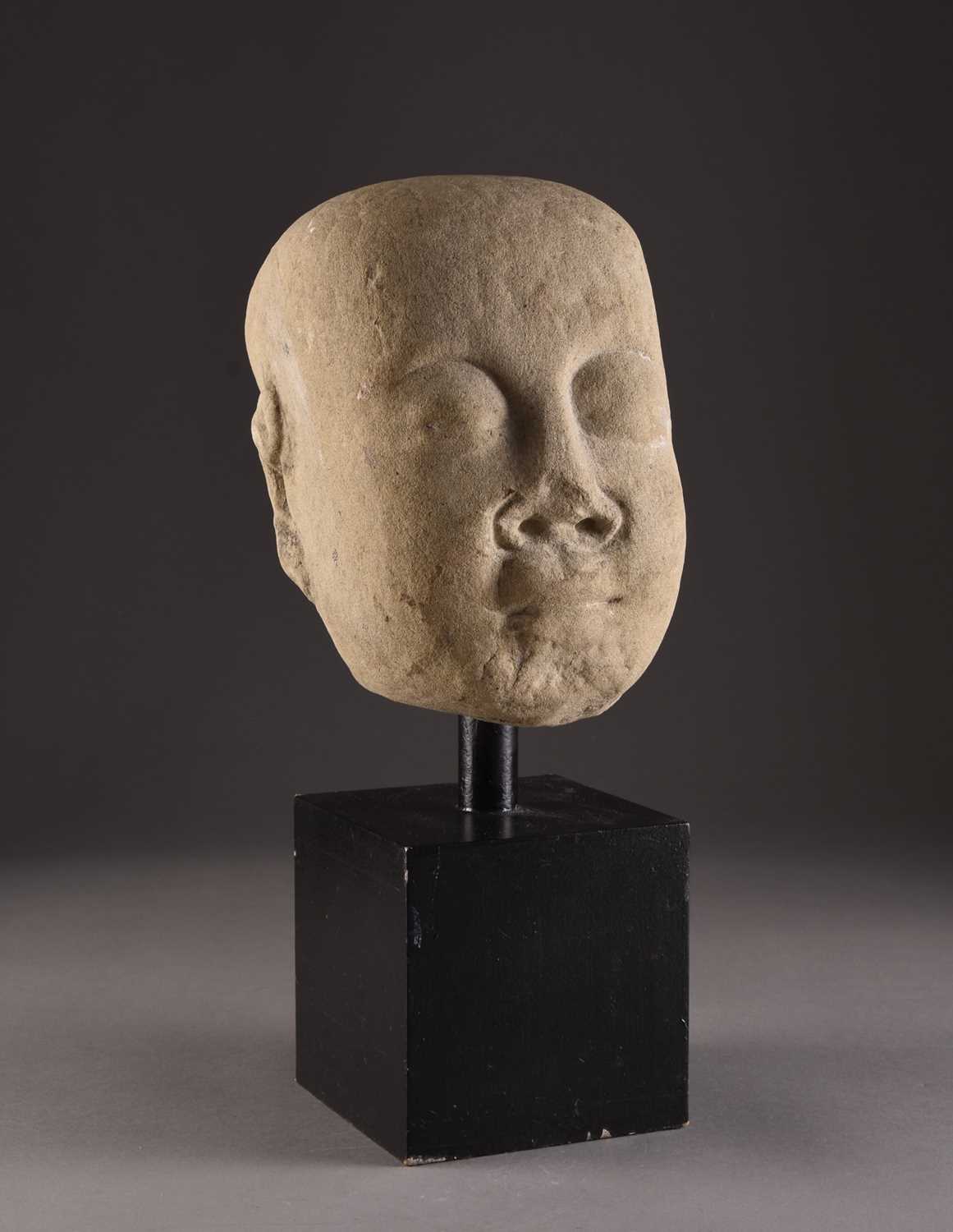 Lot 66 - A Chinese carved stone head of a luohan, Song