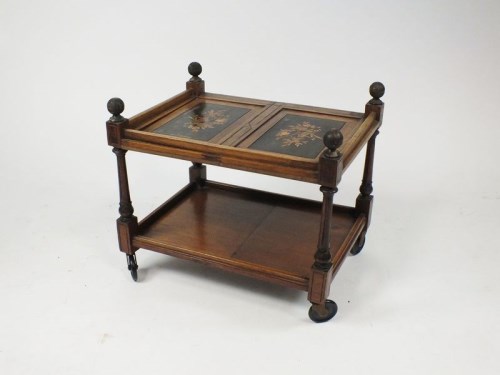 Lot 388 - A walnut two tier tea trolley, part